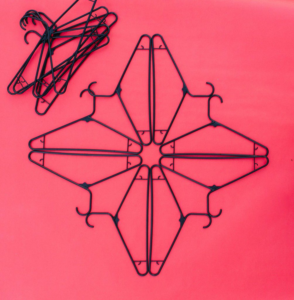 DIY Winter Snowflake Backdrop with Hangers | The Pretty Life Girls